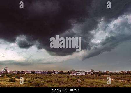 Foreboding Skies: Dark Clouds Before the Rain Stock Photo - Alamy
