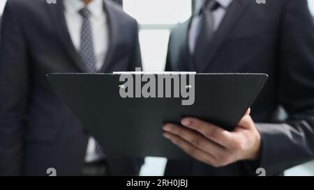 Two Businessmen Having Informal Meeting In Modern Office Stock Photo ...