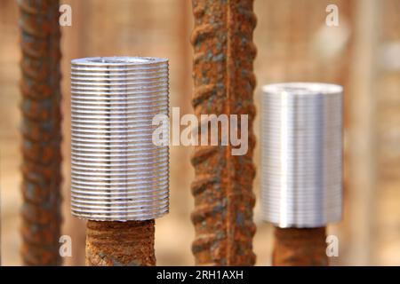 brown rebar and white threads interface in the workshop Stock Photo - Alamy