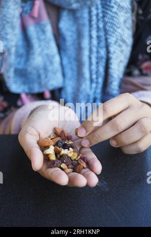women hand pick many mixed nuts Stock Photo - Alamy