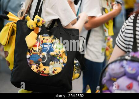 Yokohama, Japan. 13th Aug, 2023. A girl hugs an inflatable Pikachu at Minatomirai in Yokohama ...