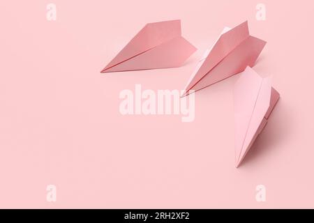 Paper planes on pink background Stock Photo - Alamy