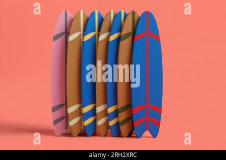 Different mini surfboards on pink background Stock Photo - Alamy