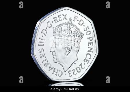 The obverse of a coronation 50p coin featuring a crowned version of ...