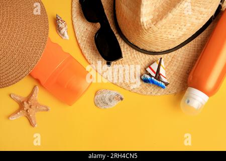 Flat lay composition with bottles of sunscreen on white background ...