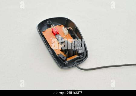 Open computer mouse with exposed electronic circuit for maintenance ...