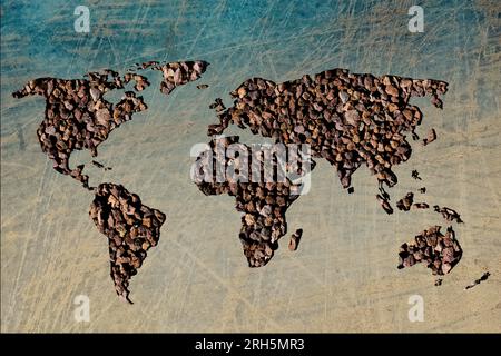 Roughly outlined world map withpebble rock background Stock Photo - Alamy
