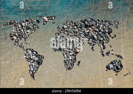 Roughly outlined world map withpebble rock background Stock Photo - Alamy