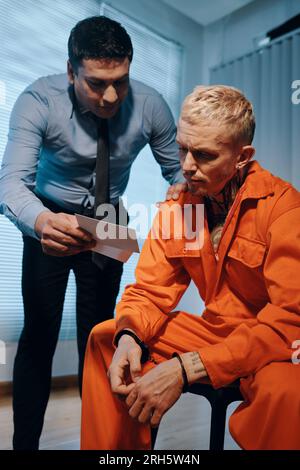 Men, detective and talking at crime scene for forensic assessment for ...