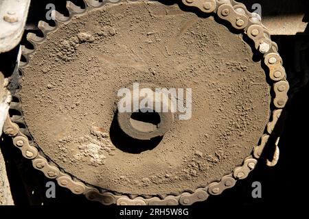 Rusty driving gears with metallic chain on a old mine train wagon for ...