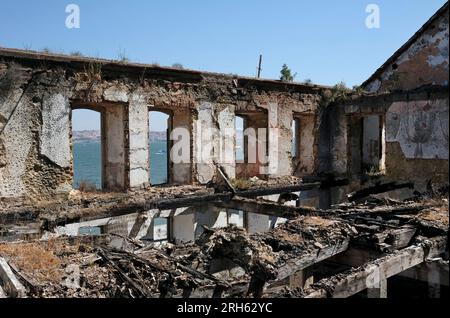 Inside the ruin of a burned out building after the fire took the roof ...