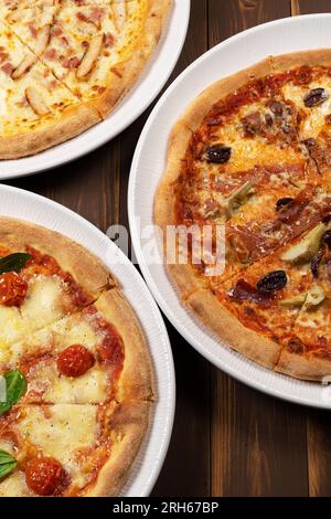 Different Italian cheese on wooden board, close-up Stock Photo - Alamy