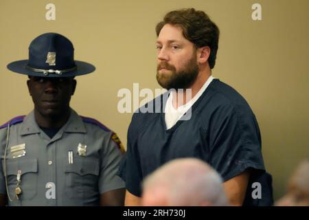 Former Rankin County sheriff’s deputy Brett McAlpin talks with his ...