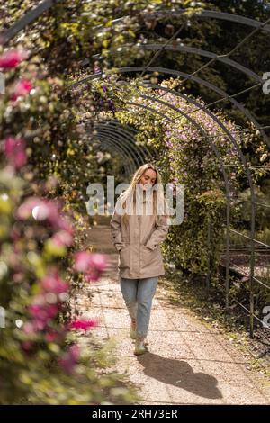Woman taking a walk in the garden with her old mother Stock Photo - Alamy