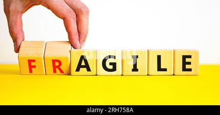 Agile or fragile symbol. Concept words Agile and Fragile on wooden ...