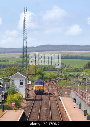 Class 47 locomotive 47828 running light passing the mechanical signal ...