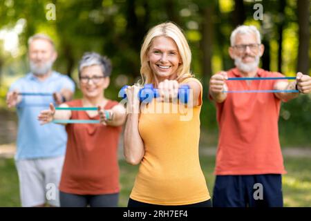 Friends fitness training together outdoors living active healthy Stock ...