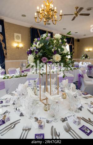 An empty wedding reception area set up with tables, ready for guests to ...