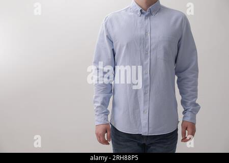 Man wearing rumpled shirt on white background, closeup Stock Photo - Alamy