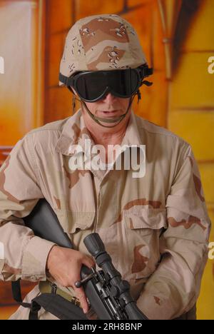Camouflaged old soldier with sniper rifle inside building Stock Photo ...