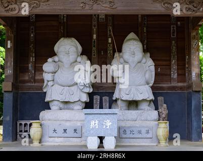 Japanese guardian statues at the traditional street in Tokyo Stock ...