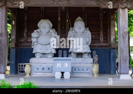 Japanese guardian statues at the traditional street in Tokyo Stock ...
