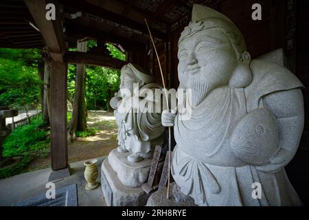 Japanese guardian statues at the traditional street in Tokyo Stock ...