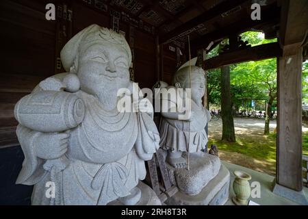 Japanese guardian statues at the traditional street in Tokyo Stock ...