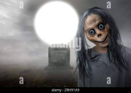 Scary Momo standing in the graveyard with a night scene background ...