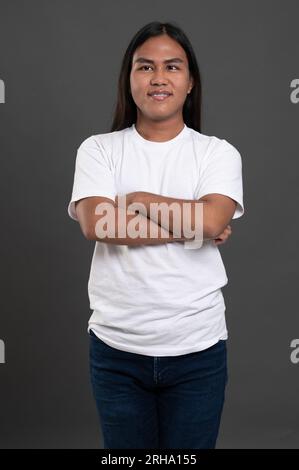 Indian guy arms crossed studio portrait Stock Photo - Alamy