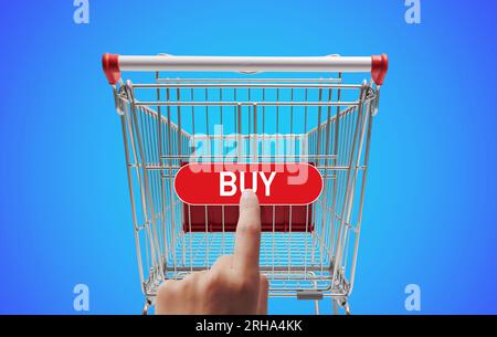 Customer pushing the buy button on the supermarket shopping cart ...