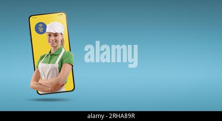 Professional smiling supermarket clerk posing in a smartphone, online ...