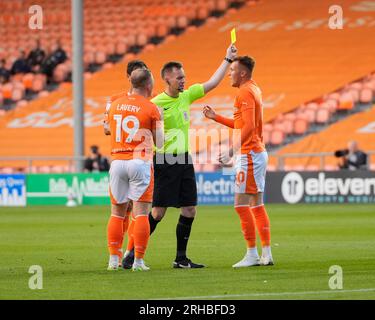 Match referee Ross Joyce shows a red card to Newport County's Mark O ...