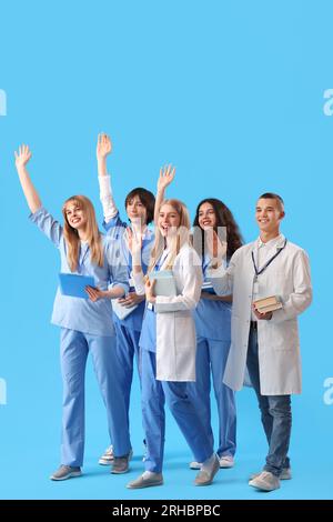 Medical students on blue background Stock Photo - Alamy