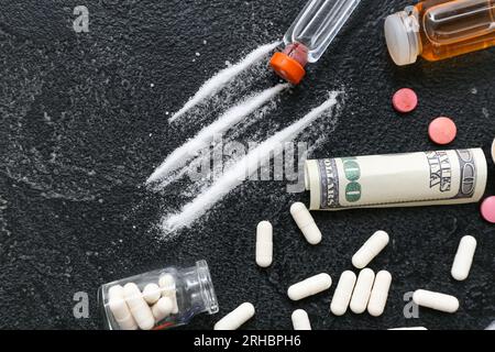 Different drugs and money on dark background, closeup Stock Photo - Alamy