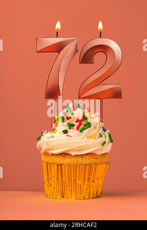 Candle number 72 - Cake birthday in rhodamine red background Stock ...
