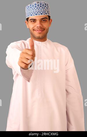 Omani Man making hand gesture Stock Photo - Alamy