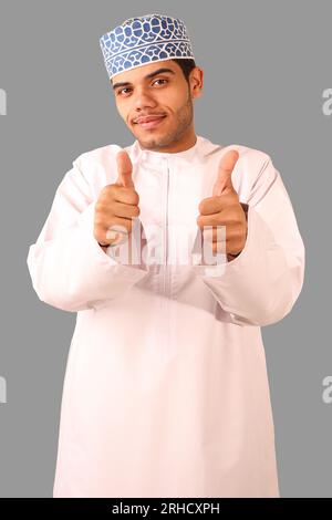 Omani Man making hand gesture Stock Photo - Alamy
