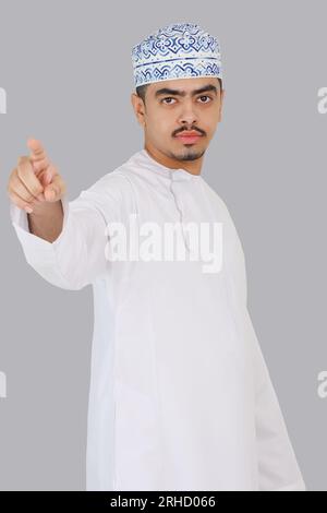 Omani Male making hand gesture Stock Photo - Alamy