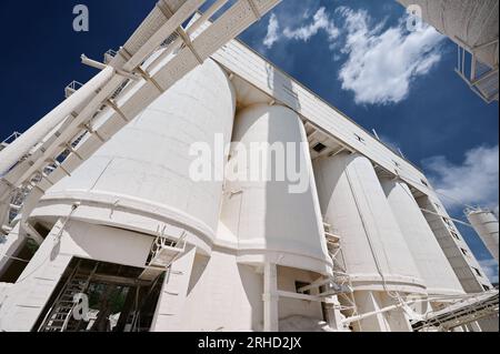 Concrete silos for storage of limestone products at plant Stock Photo ...