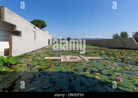 The meditation pavilion, surrounded by pools with plants and water ...