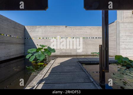 The meditation pavilion, surrounded by pools with plants and water ...
