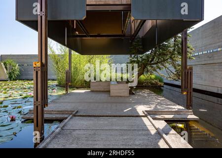 The meditation pavilion, surrounded by pools with plants and water ...