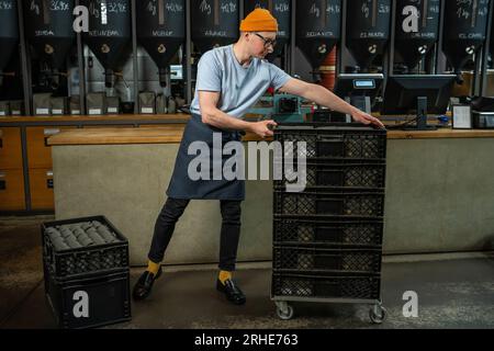 Coffeemaker with coffee packages in cafe, process making and production ...