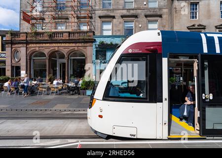 Edinburgh tram at The Shore stop on Constitution Street in Leith ...