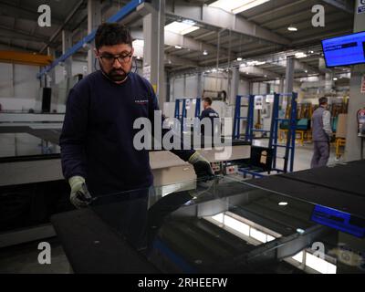 Factory for windows and car Windshield production. Manual worker ...
