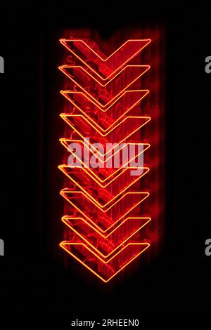 Set of red arrows neon light pointing left Stock Photo - Alamy
