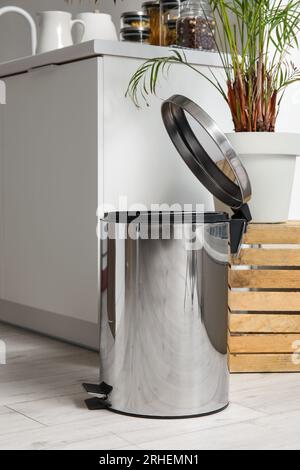 Opened metallic trash bin in interior of modern kitchen Stock Photo - Alamy