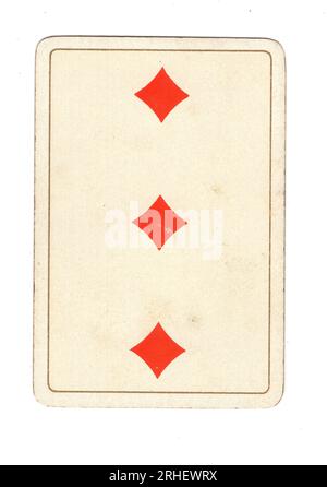 An antique three of diamonds playing card isolated on a white ...