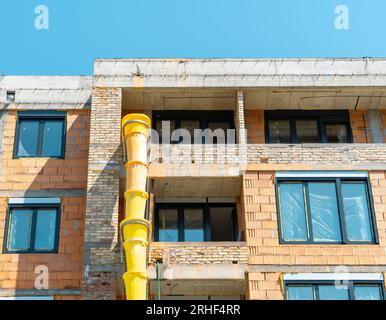 Construction waste Garbage Chute, tube to trash with Many windows on ...